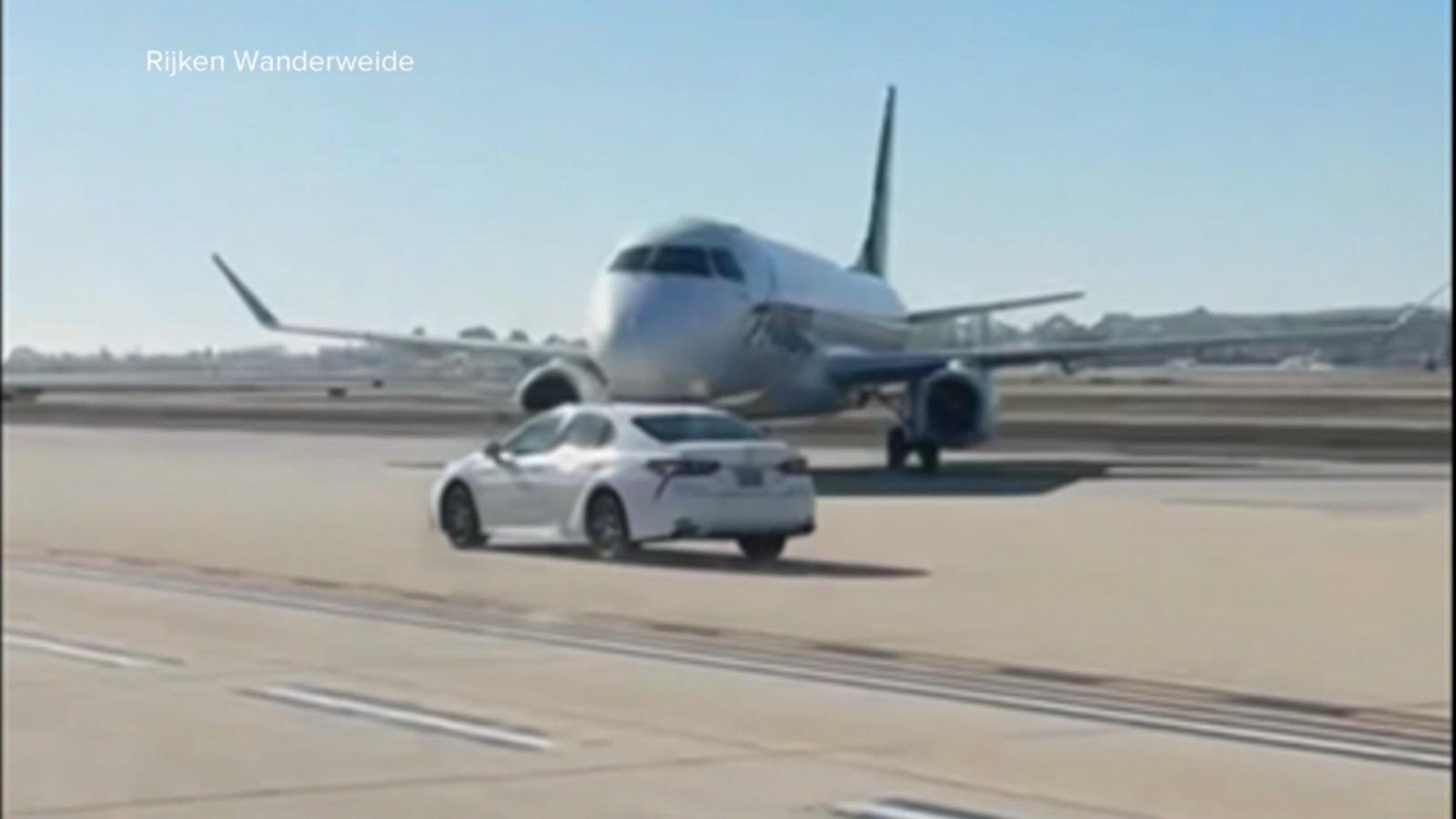 Pilots sound alarm after car races past planes taxiing at busy airport ...