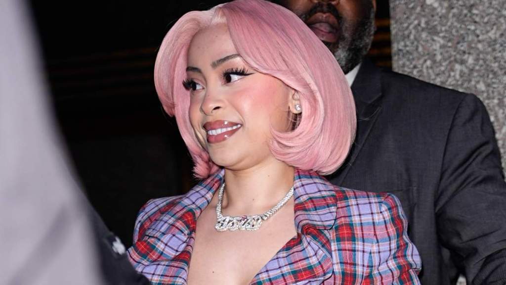 Ice Spice's plaid skirt suit features a cheeky neckline