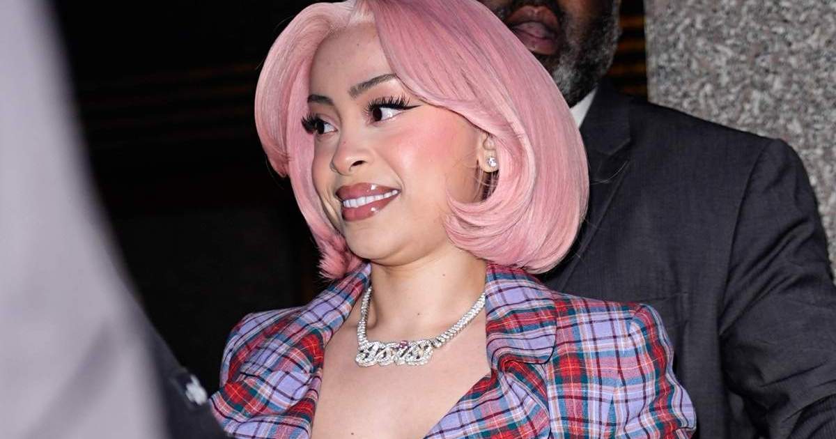 Ice Spice's plaid skirt suit features a cheeky neckline