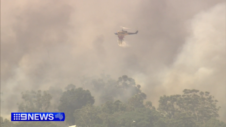 Warnings lowered to watch and act for two Perth bushfires