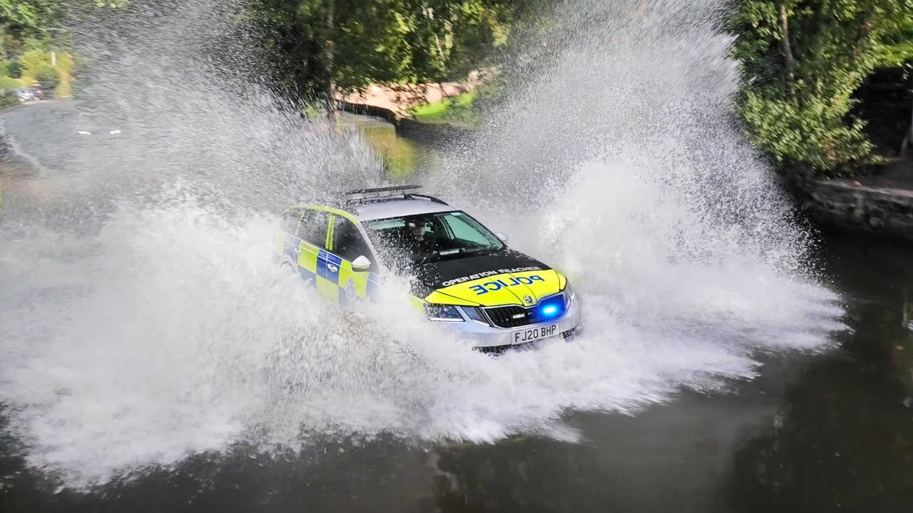 Police patrol car goes full send into flooded road