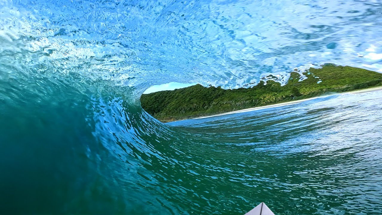Surfing mini A-frame tubes up the coast