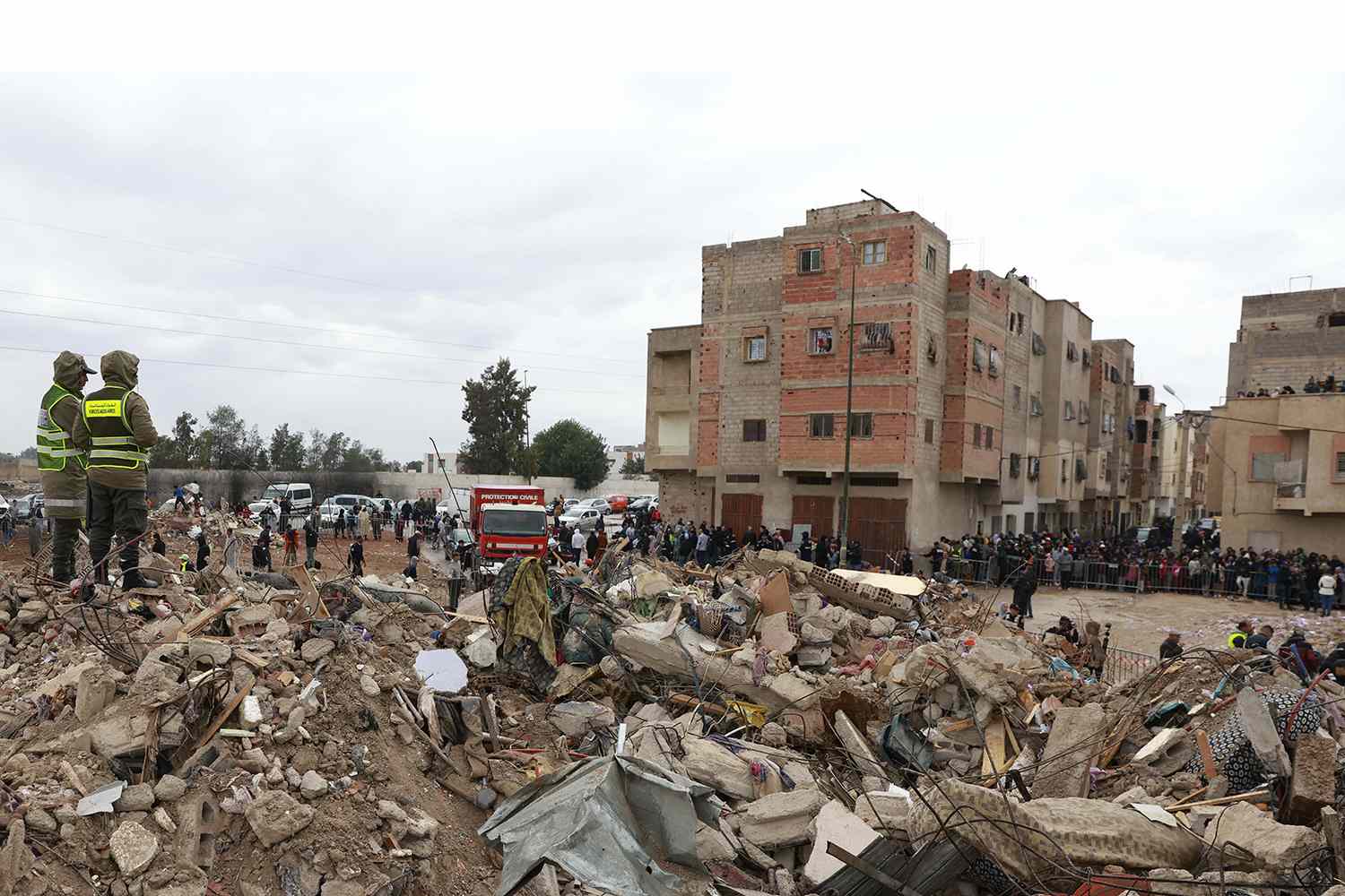 At least 22 killed after pair of multistory buildings suddenly collapse ...