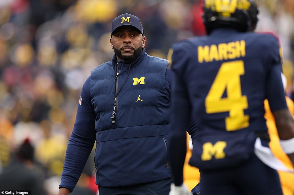 Fired Michigan football coach arrested after night of chaos