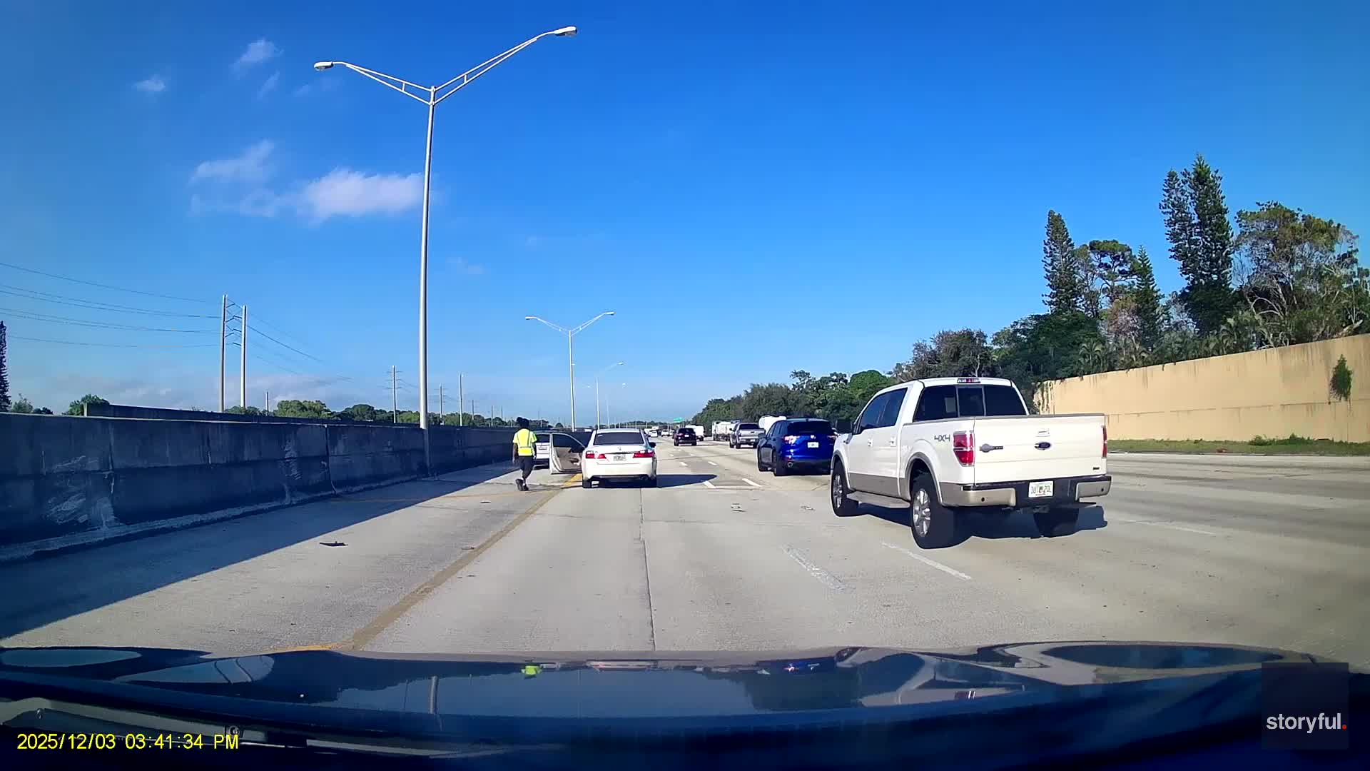 Shocking moment angry motorist hits and kicks car on highway