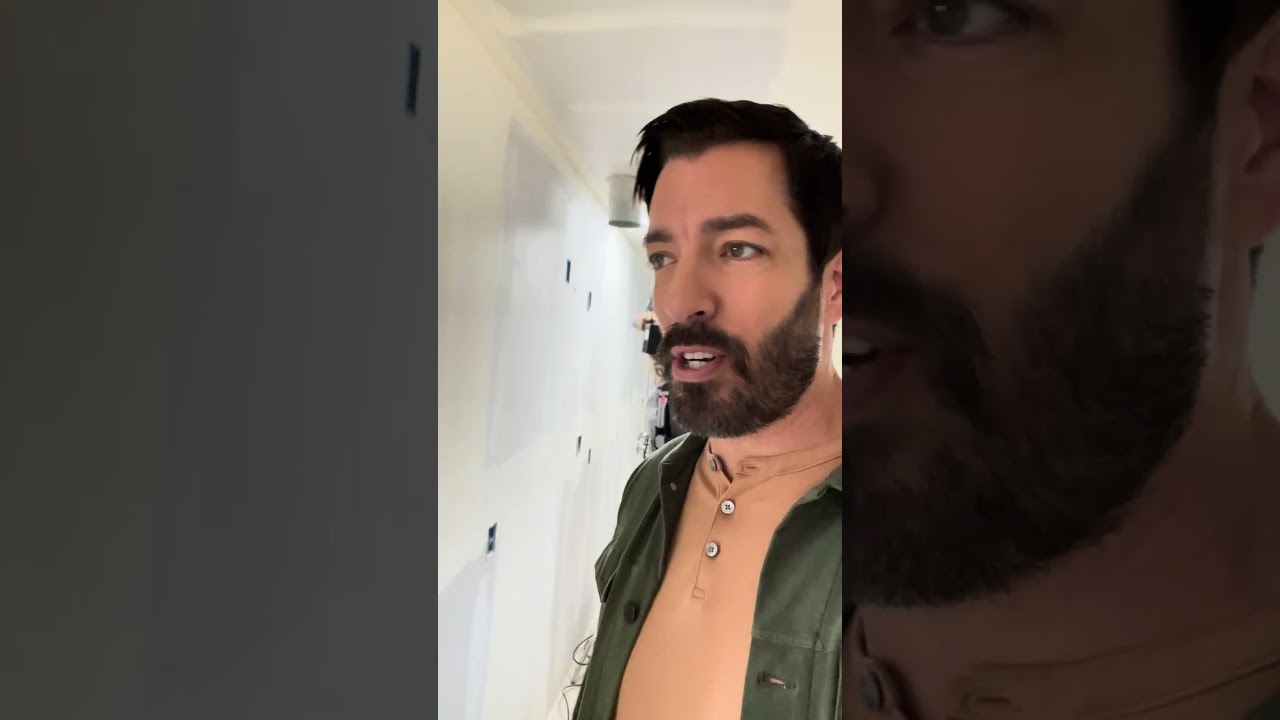 Jonathan Scott takes an unusually interesting phone call on set