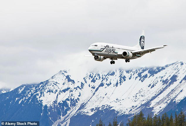 Man, 36, charged after trying to open plane door during Alaska Airlines ...