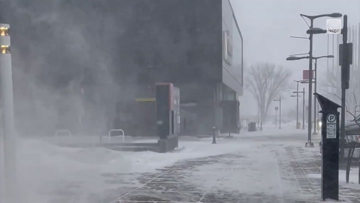 Strong winds blow snow all around downtown Saskatoon