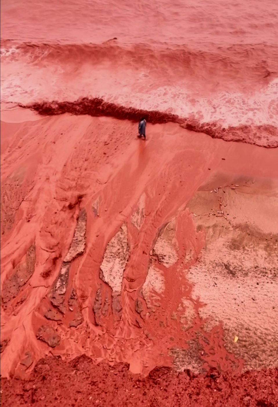Rain creates a crimson spectacle on Iran's Hormuz Island for the first ...