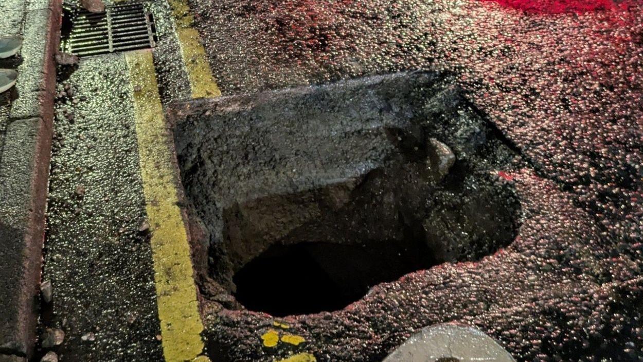Vehicles damaged by '4ft-deep' collapsed manhole