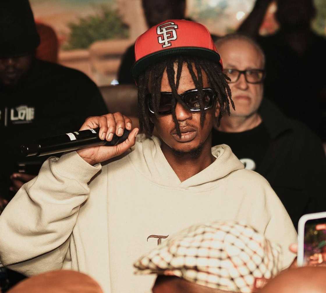 Watch rapper Emtee fall asleep during his performance