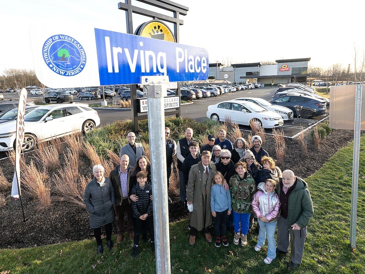 Grocer honored with street sign unveiling near new supermarket in the ...