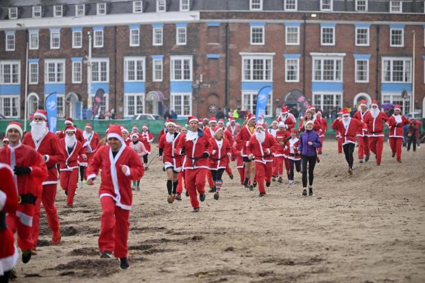 Hundreds of Santas to descend on beach as festive run returns this weekend