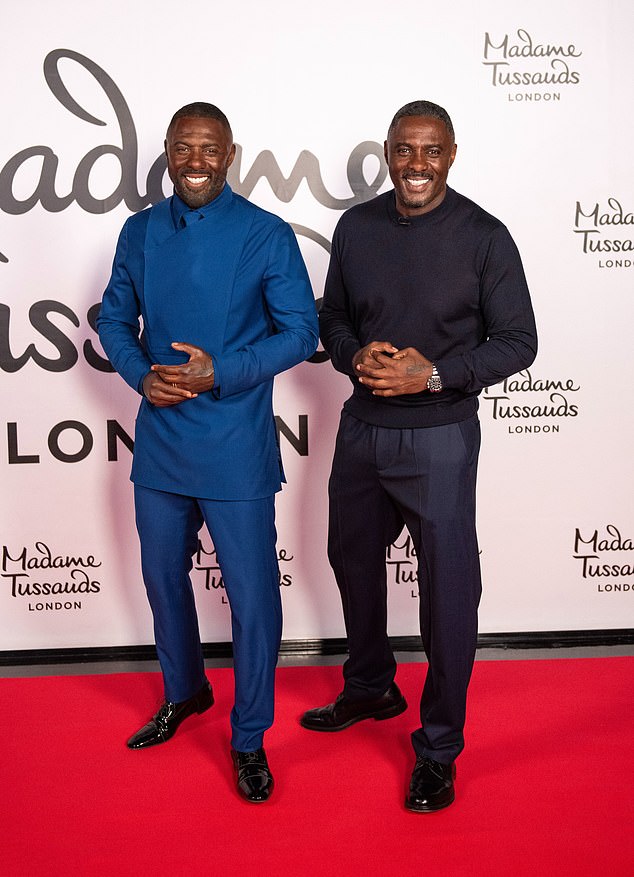 Idris Elba looks delighted as he poses next to his waxwork doppelganger ...