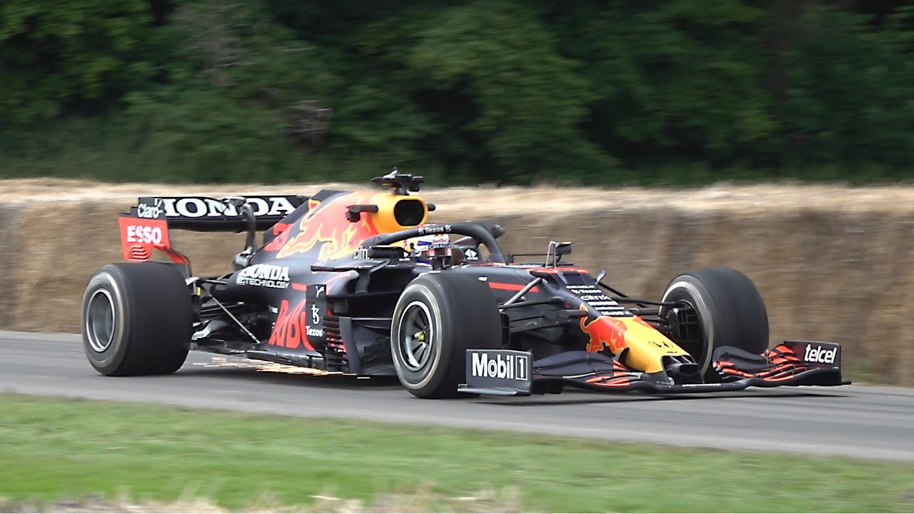 Formula 1 car flying past at full throttle