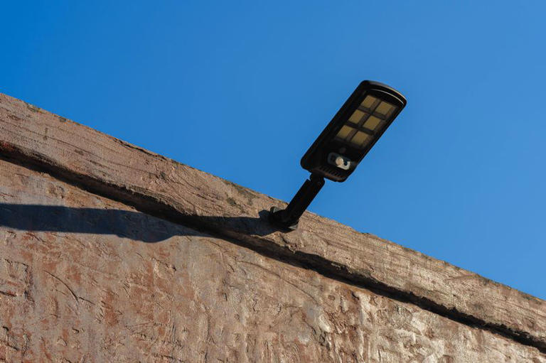 Neighbors clash over motion-activated sensor light that's been there 25 ...