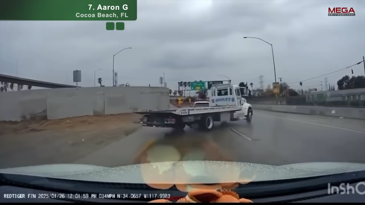 Truck loses control on wet, slippery road