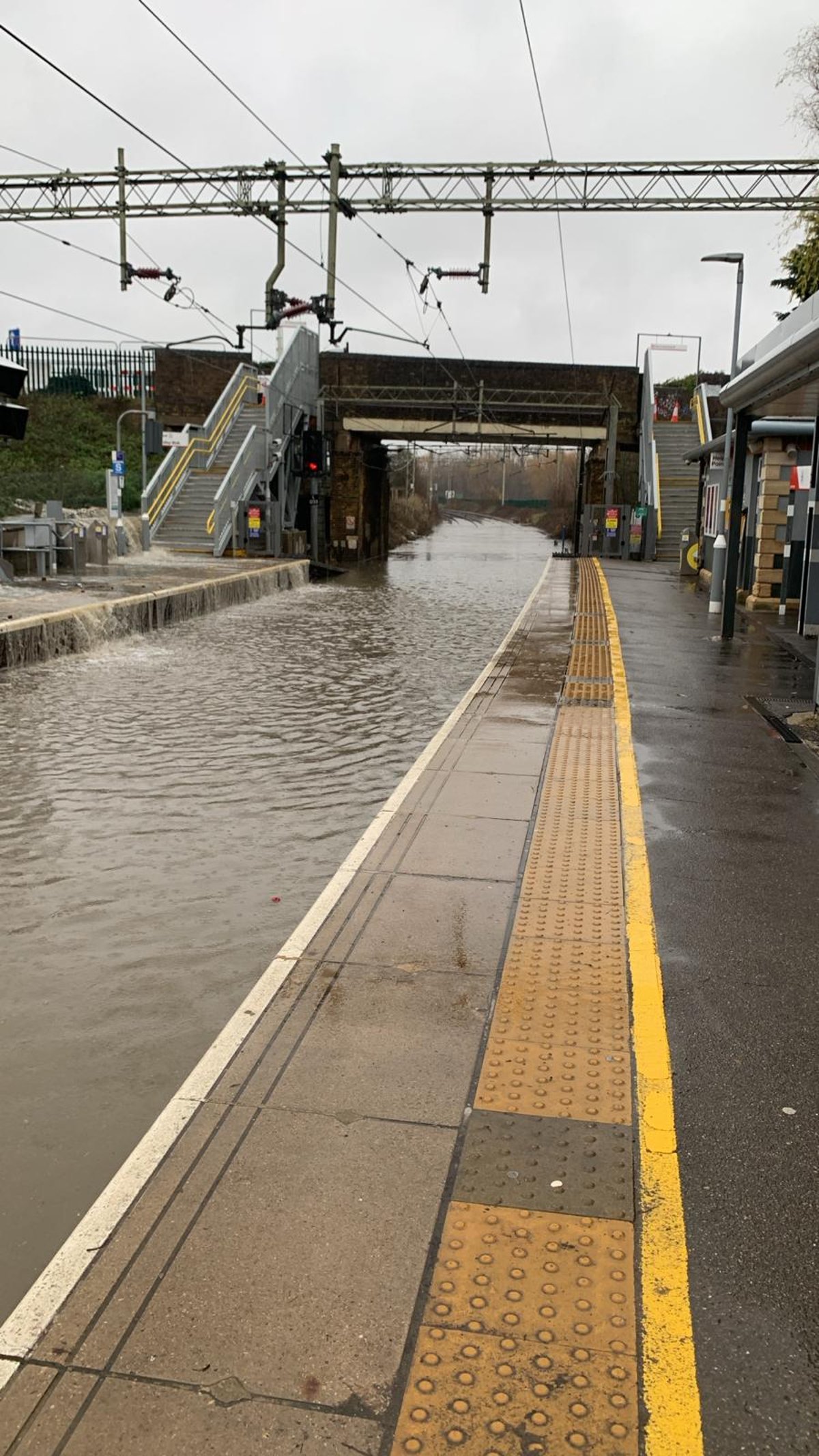 Pictures show flooded train station as it's closed until Christmas Eve