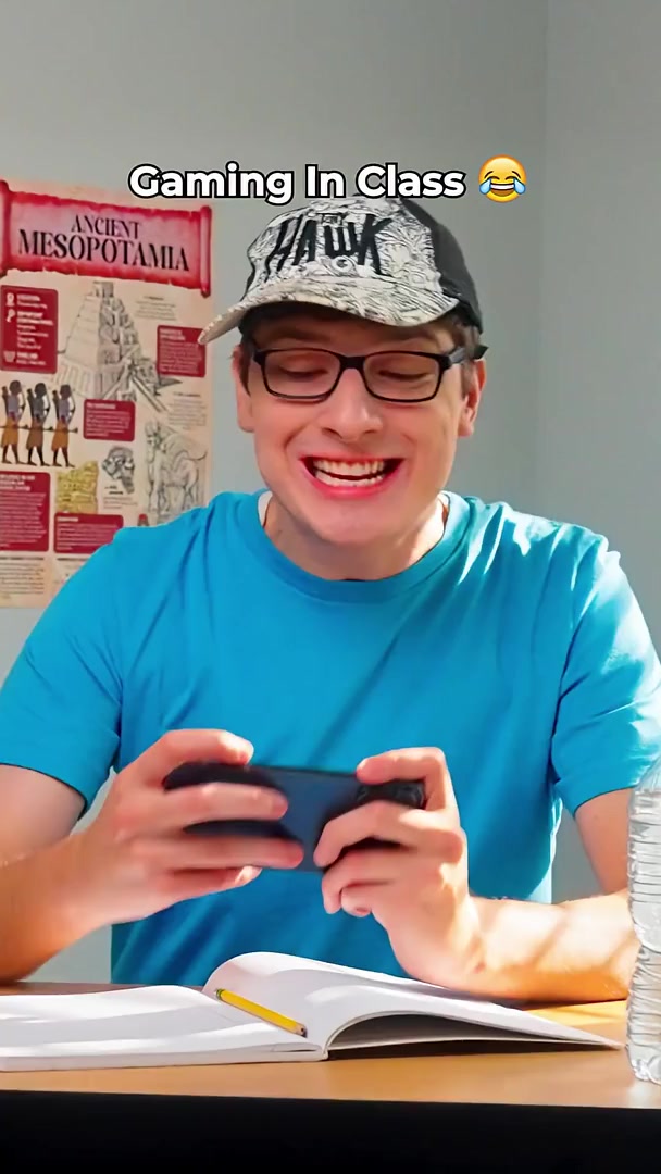 A child humorously attempts to game on an iPad during class while ...