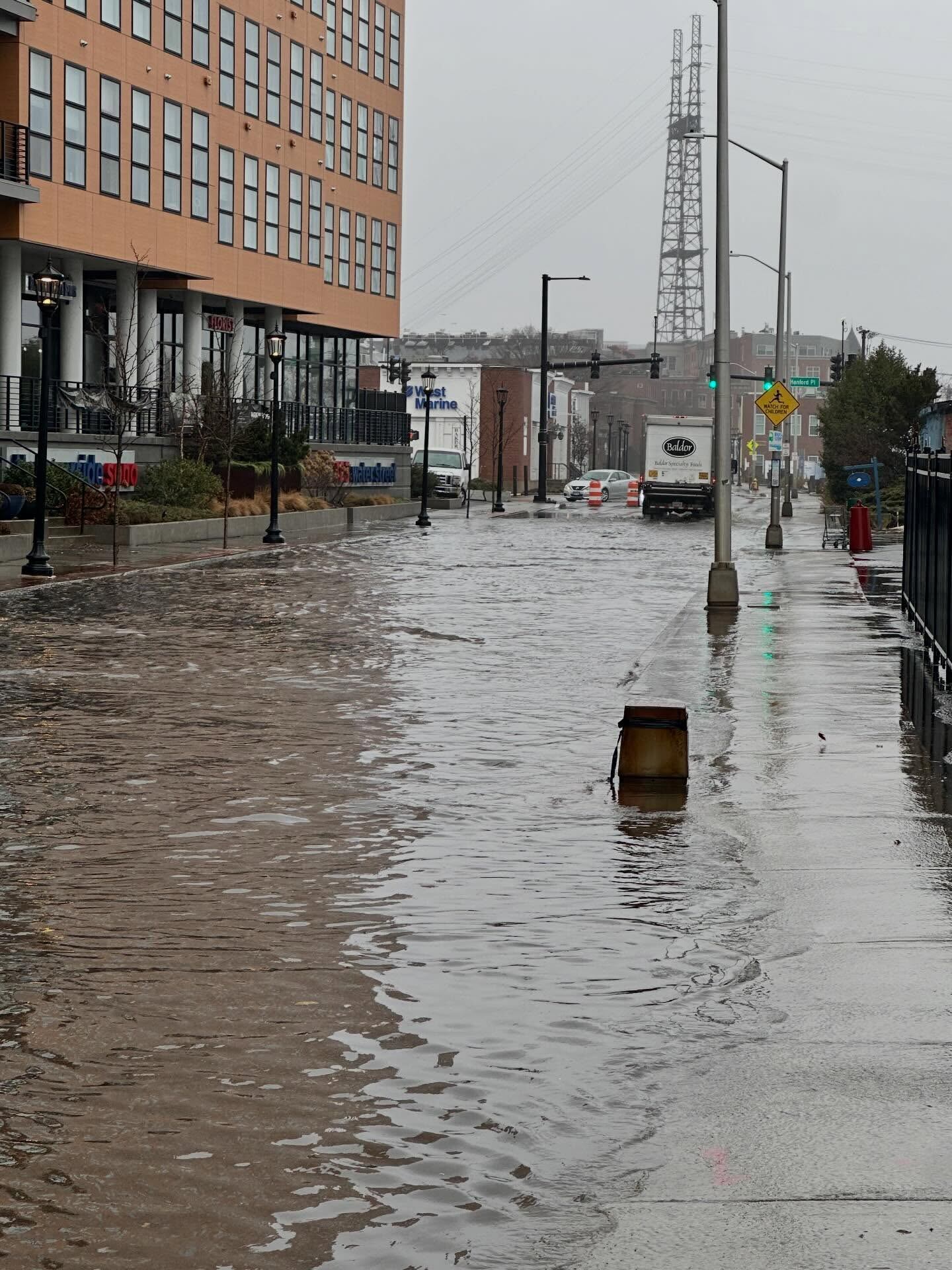 Strong winds and rain cause power outages, road closures