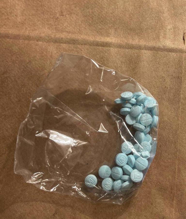 Sonora police arrest two after fentanyl, guns found during motel raid