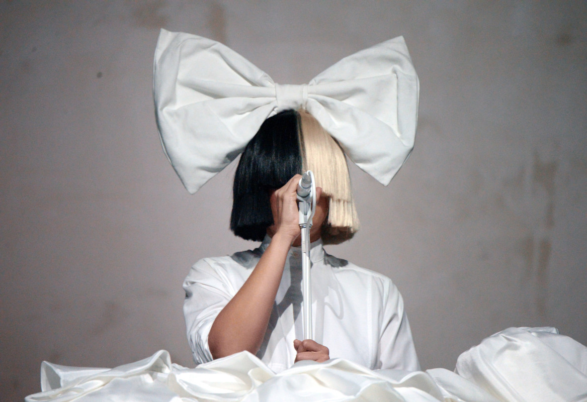 Sia steps out in rare red carpet appearance showing her entire face