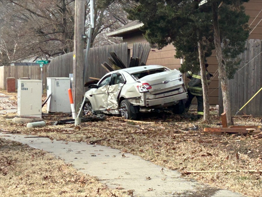 Deputies: Driver on the run takes out fence in east Wichita crash