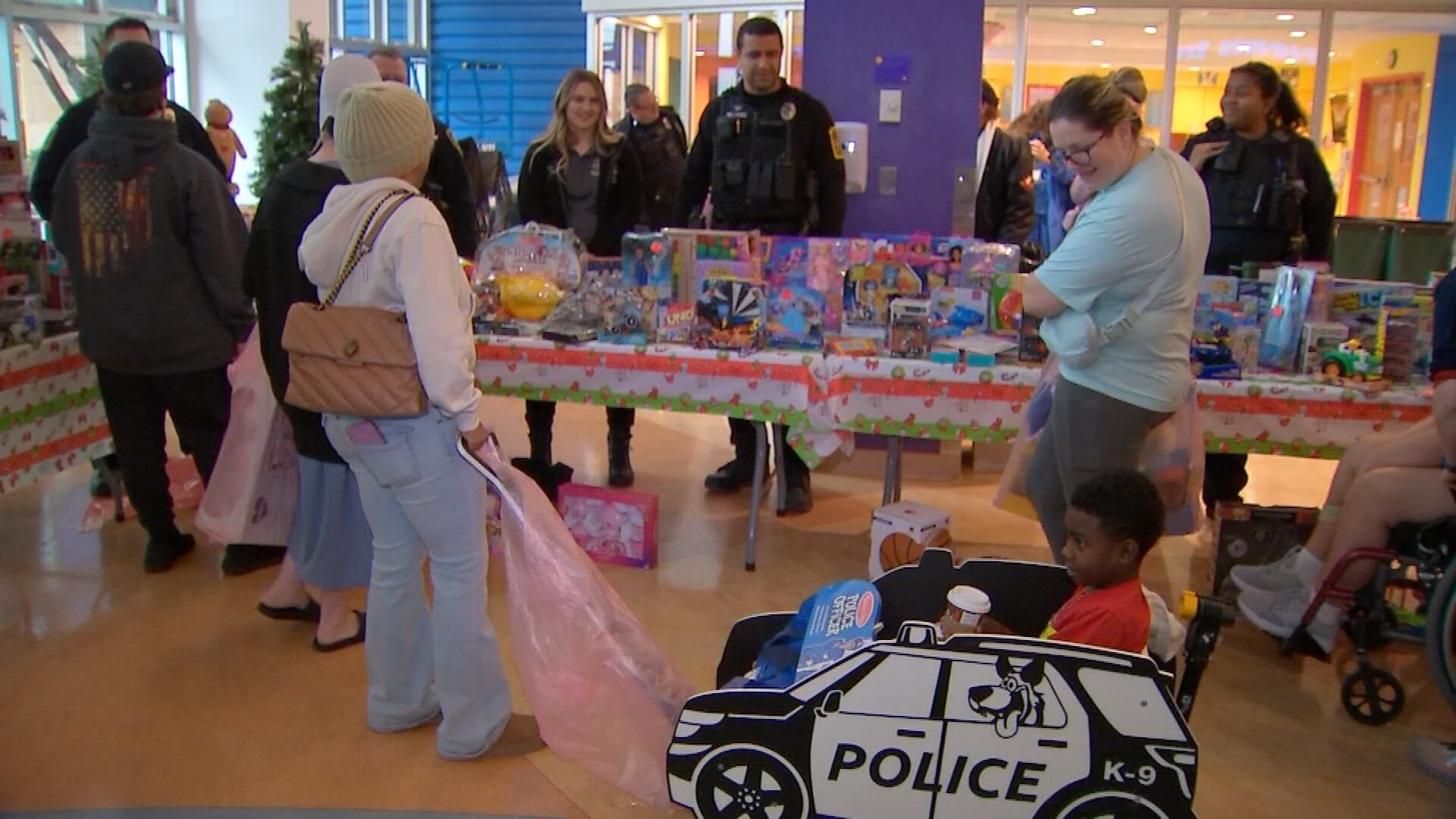 Local police officers spread holiday cheer, give presents to kids at ...