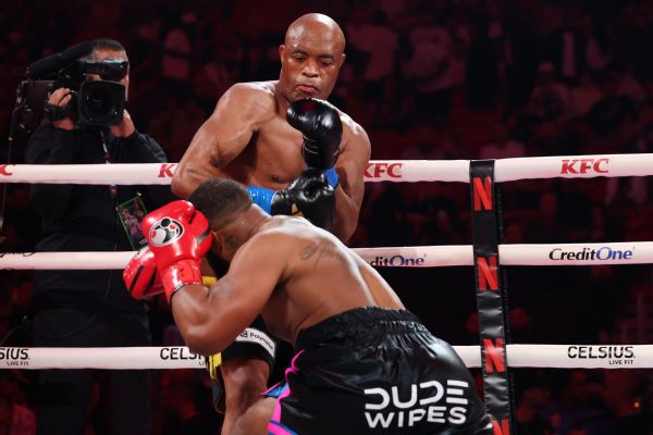 Anderson Silva drops Tyron Woodley, rolls to 2nd-round TKO win