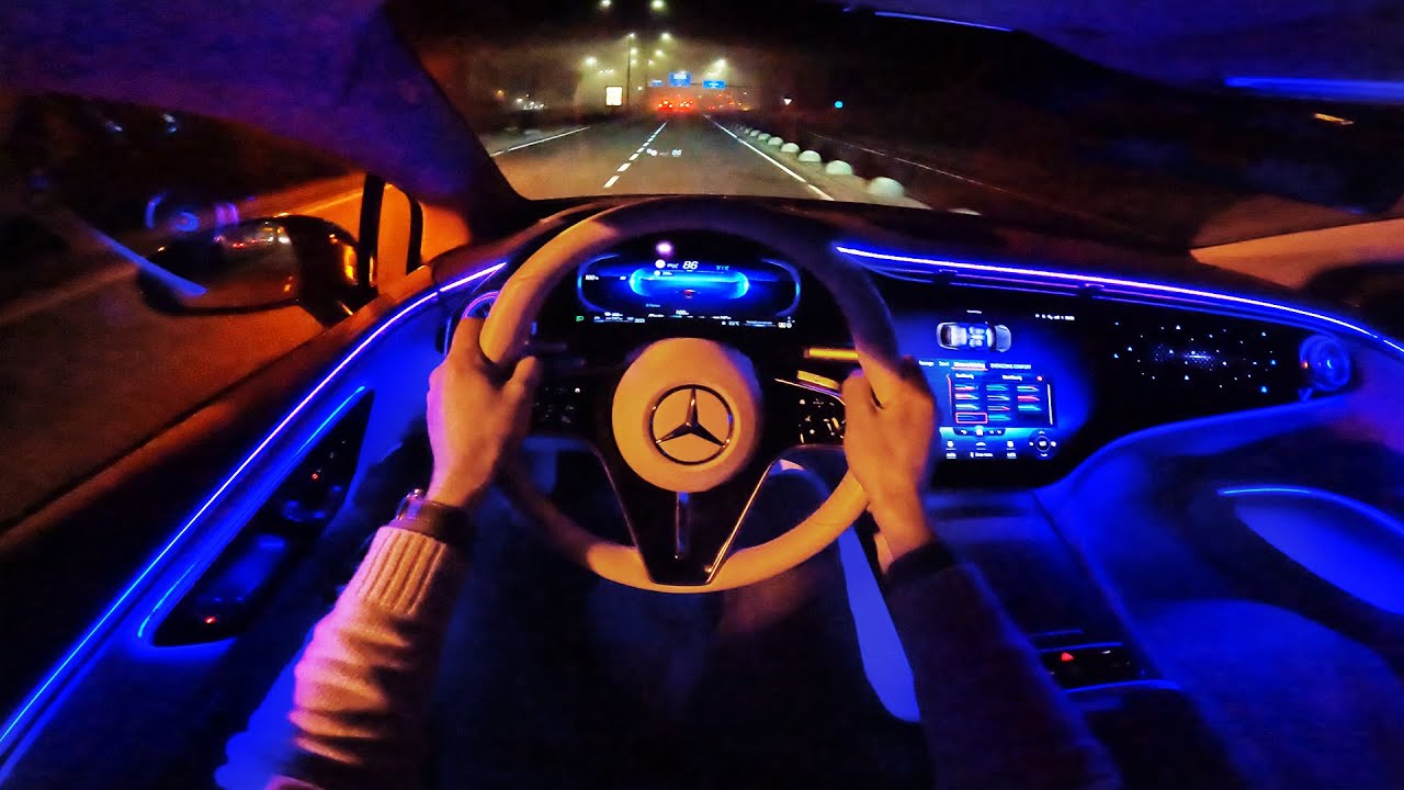 Luxury electric car night drive with stunning ambient lighting