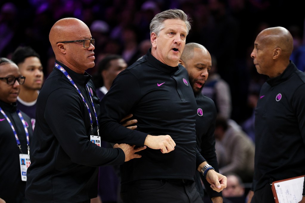 Timberwolves coach Chris Finch has to be restrained by staff as he’s ...
