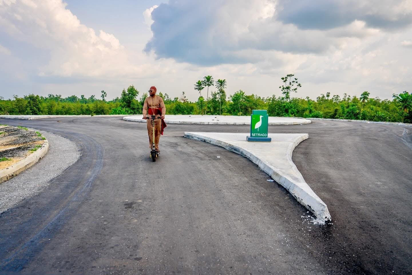 Video: Olu of Warri rides scooter to inspect road in Delta