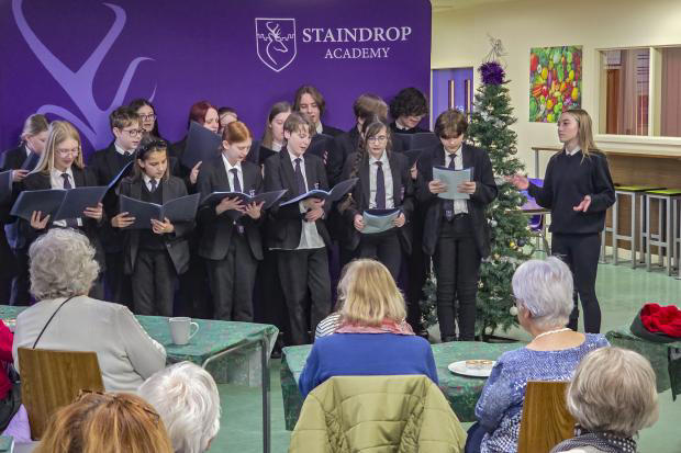 Pupils bring community together at school’s Christmas party