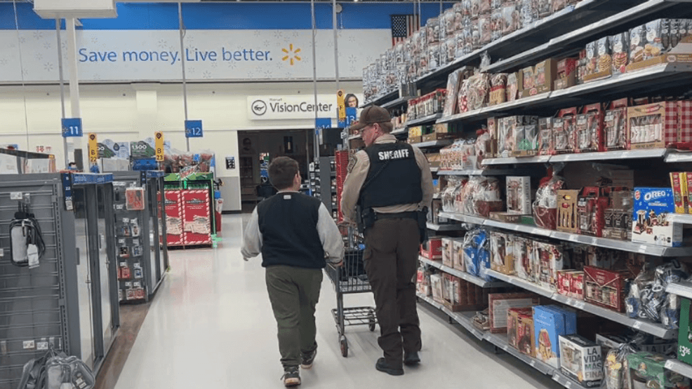 Bedford police join kids for holiday shopping in 'Shop with a Cop' event
