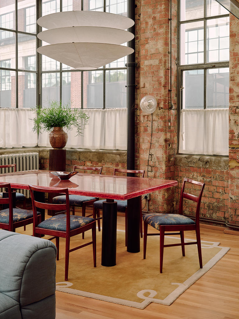 Lilac paint and a powder blue sofa soften up this industrial London loft