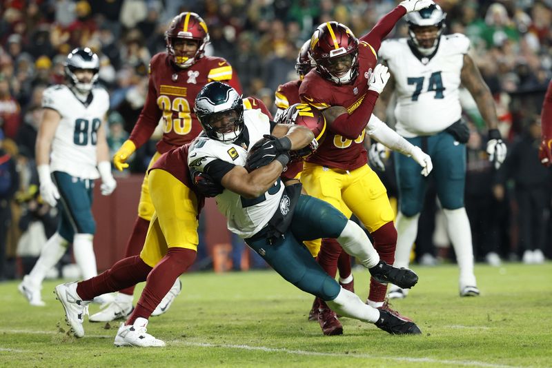 Saquon Barkley, Eagles clinch NFC East title with win over Commanders