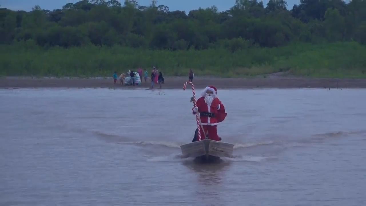 Santa Claus navigates through Brazil's Amazon delivering gifts and ...