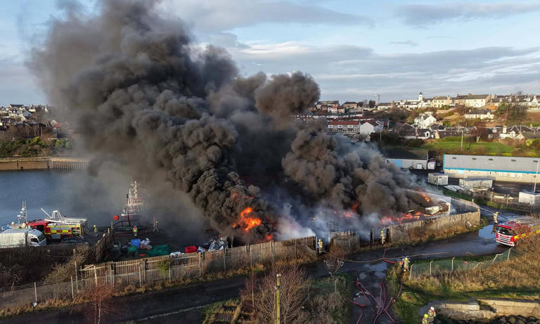 Moment massive fire rips through HGVs and trailers at docks sending ...