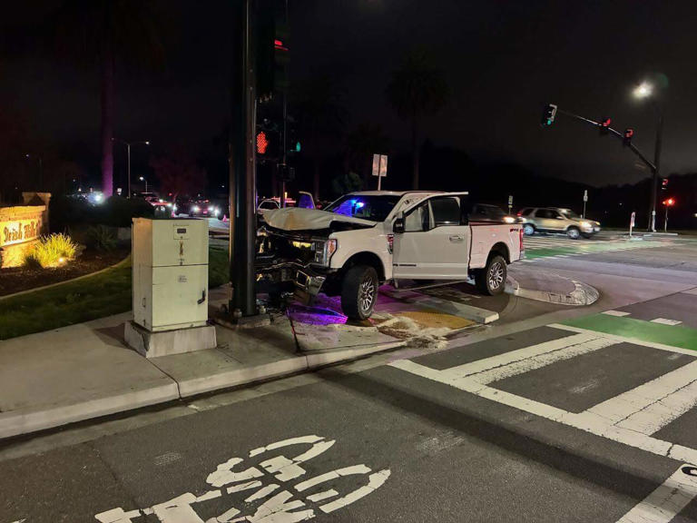 Truck crashes outside SLO shopping center, driver flees and is quickly ...