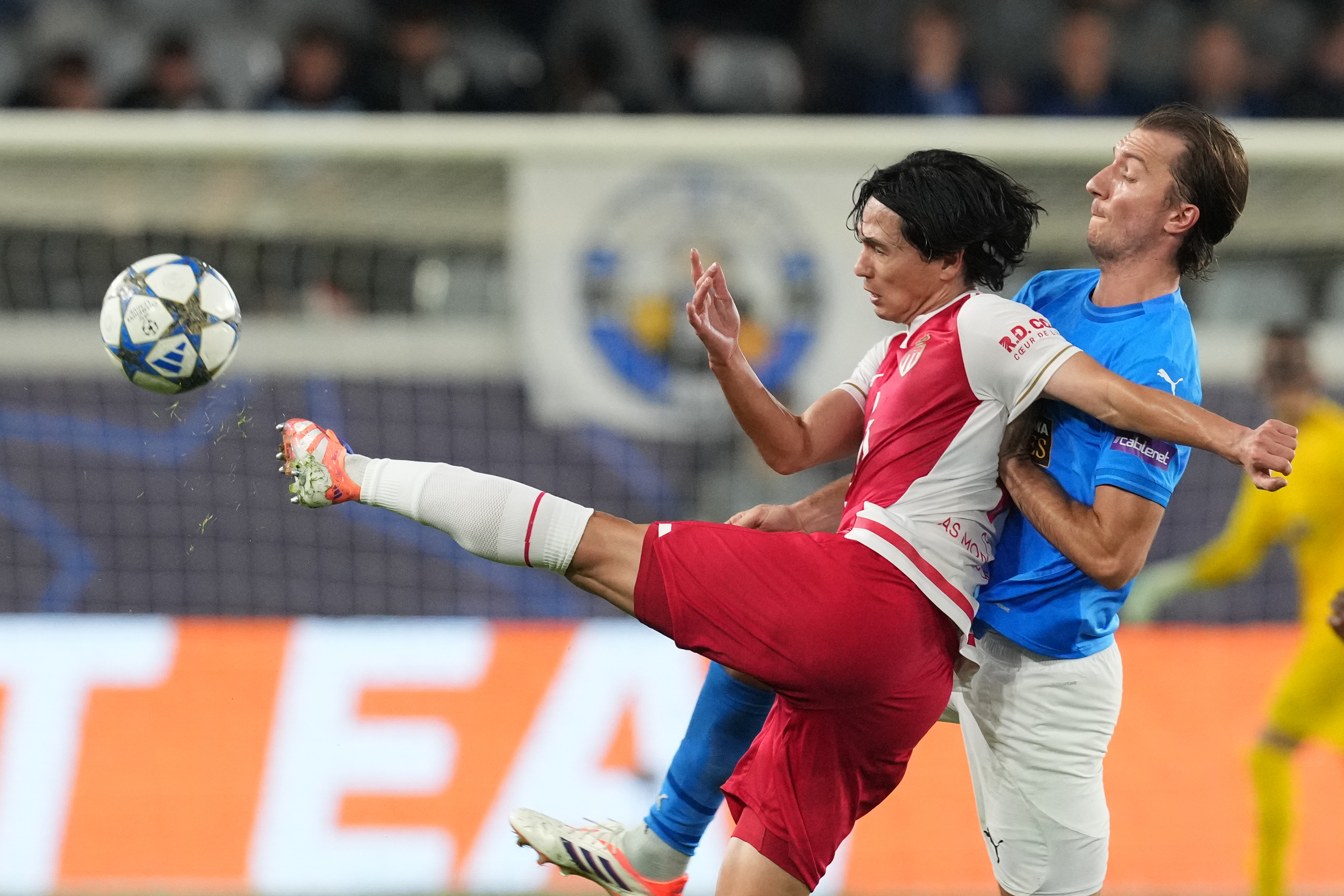 Japan forward Takumi Minamino stretchered off with knee injury in ...