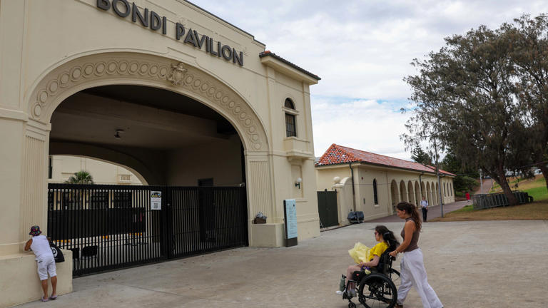 Flowers cleared from scene of Bondi shooting more than a week after attack
