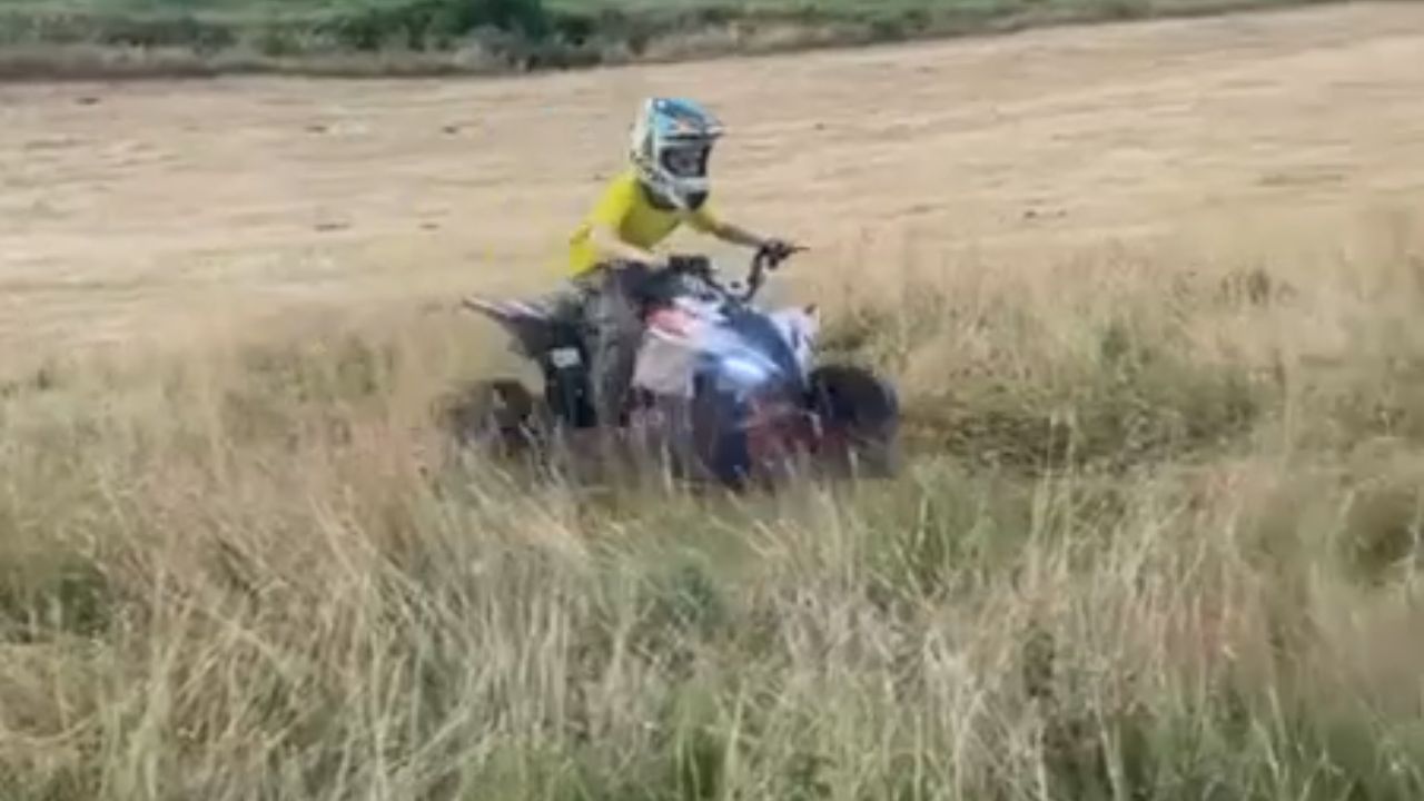 Little boy rides quad smoothly until a jump sends him into a fall