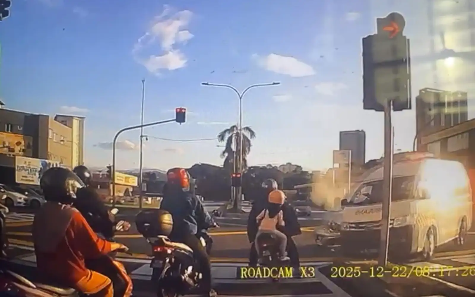 Ambulance veers into motorcyclists after collision with car