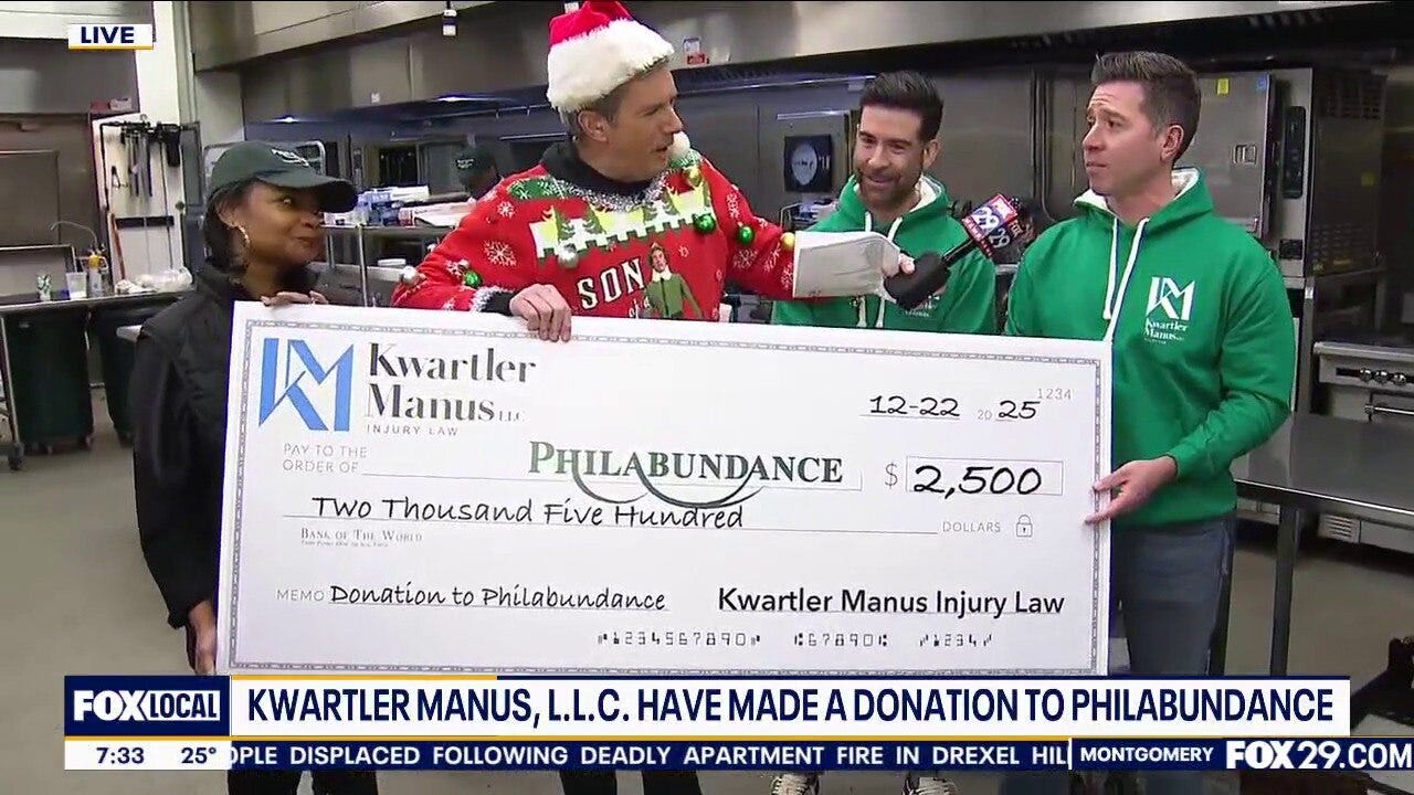 A very Kelly Christmas: Philabundance check presentation