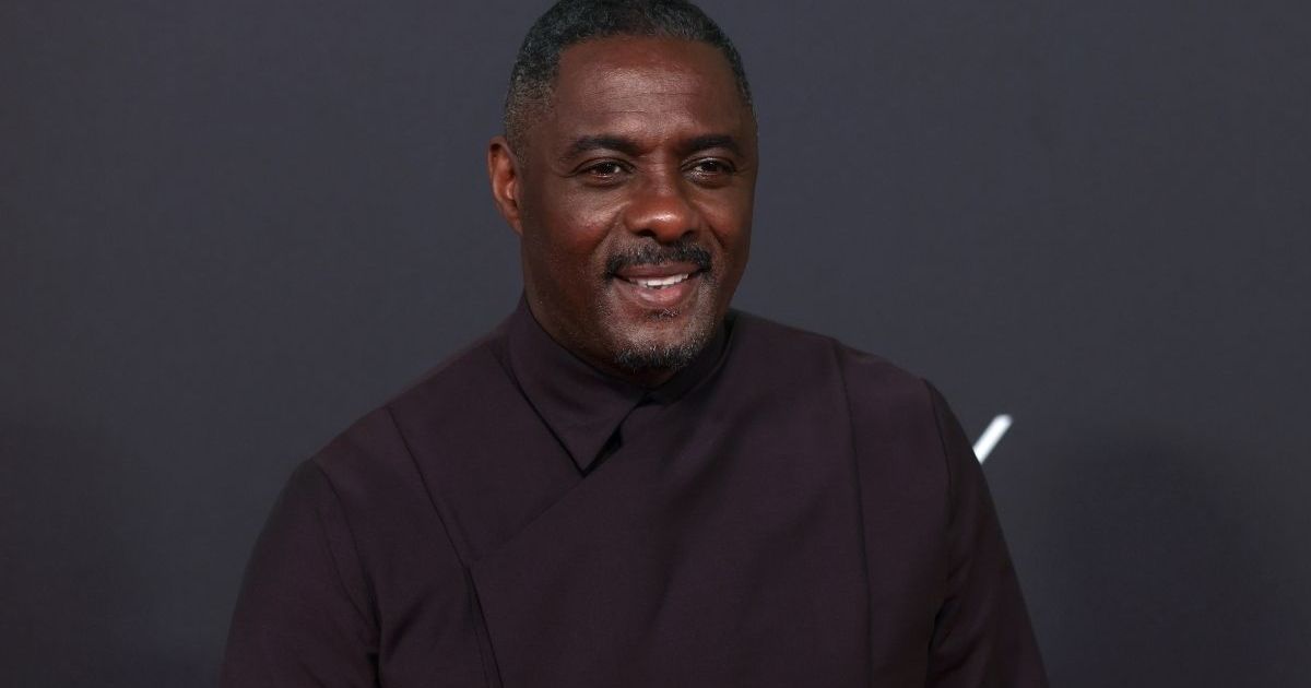 Idris Elba Poses With James Bond Actor Statues & We All Know Why