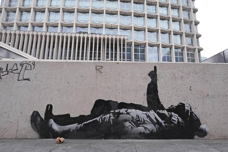Artwork thought to be Banksy appears at foot of Centre Point skyscraper ...