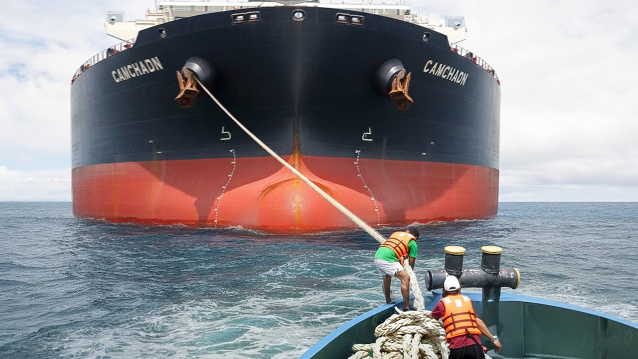 A day in the life of tugboat sailors pulling massive ships at sea