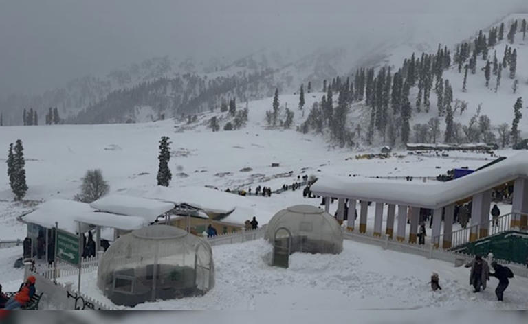 Snow turns Gulmarg into winter wonderland, tourists turn skiers, ride ...