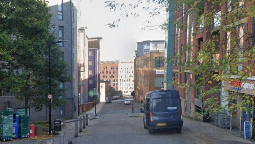 Man arrested after shots fired at two buildings