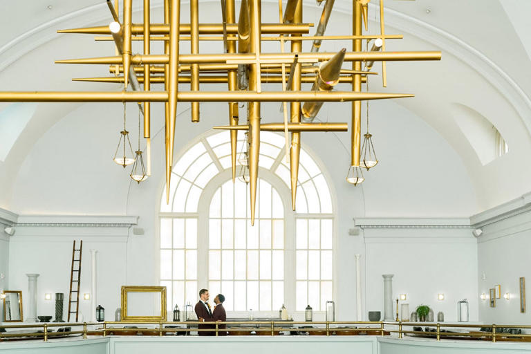 These dapper grooms wore burgundy tuxedos to their “tropical disco” wedding